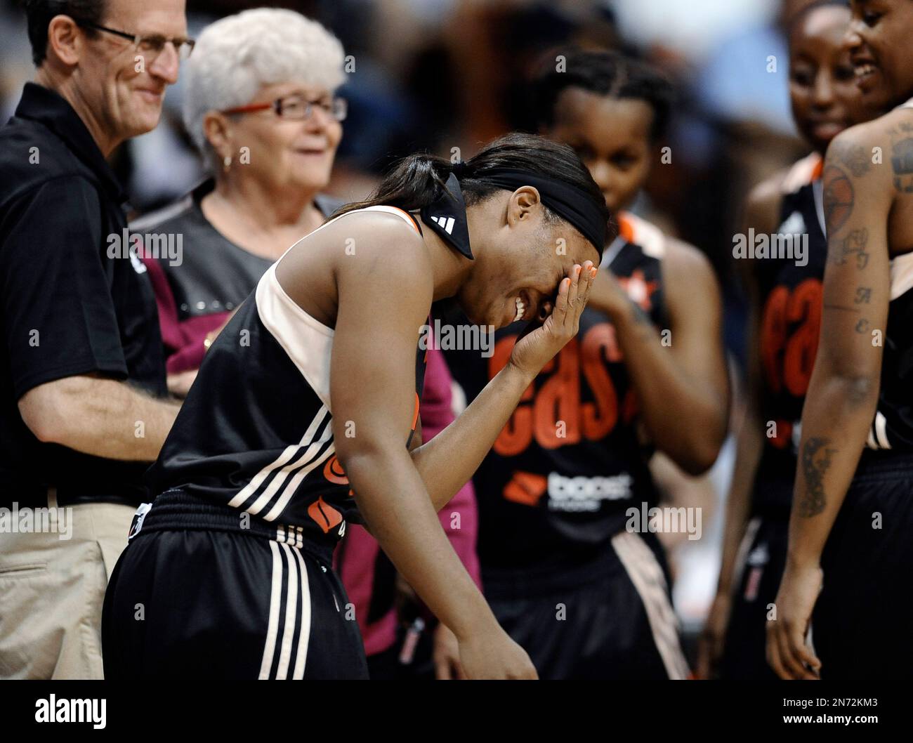 East's Ivory Latta, of the Washington Mystics, laughs after receiving a ...