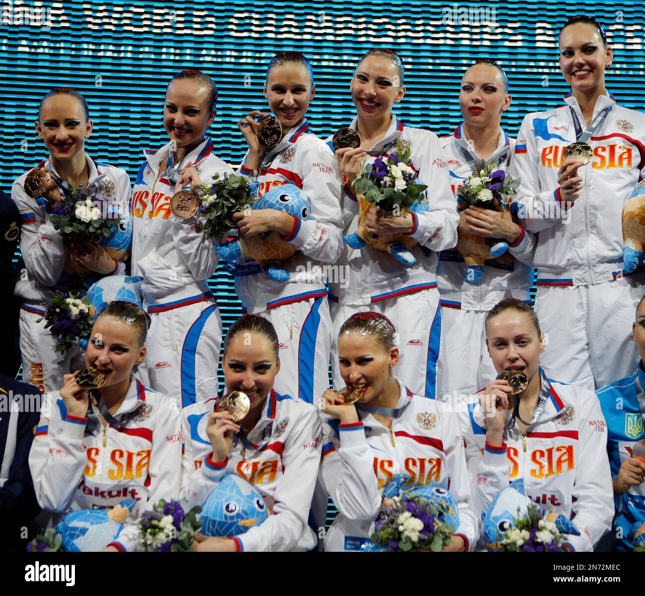 Team Russia display their gold medals the synchronized swimming free ...