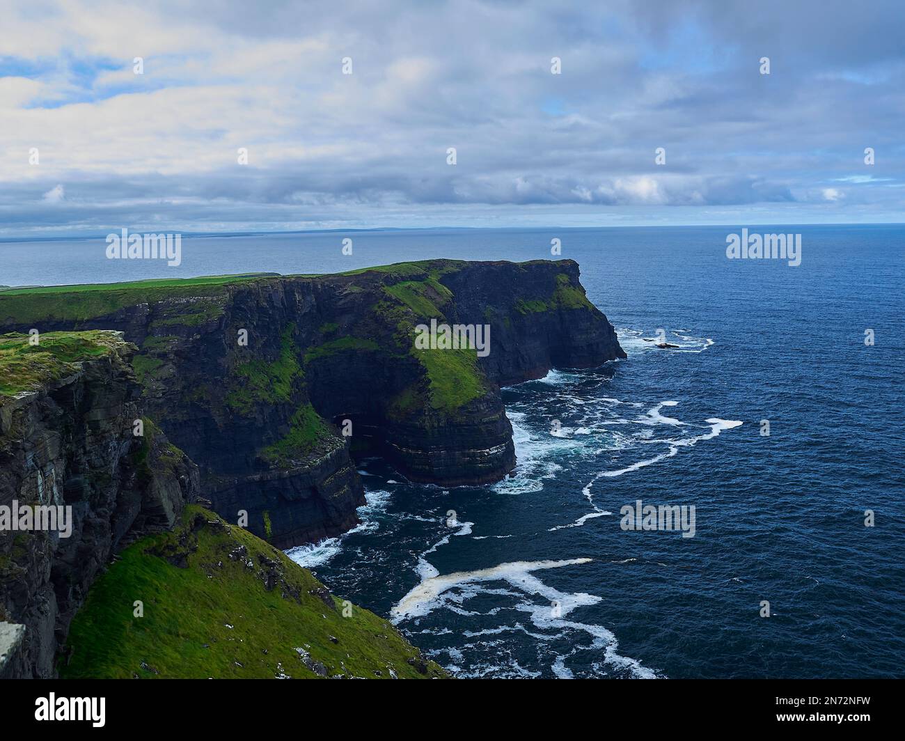 view over the cliffs of Moher in Ireland, a popular hiking destination ...