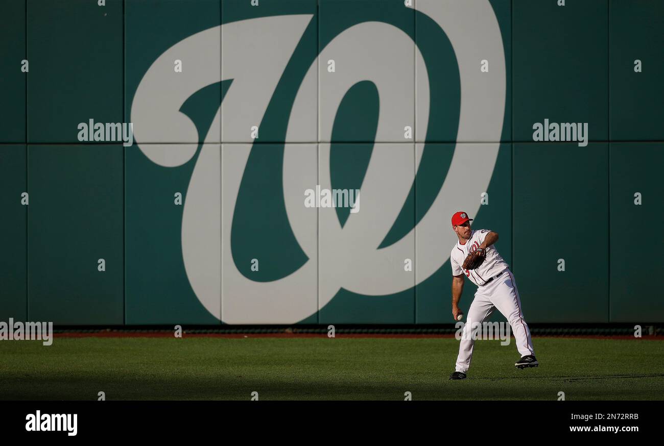 Washington Nationals pitcher Ross Ohlendorf warms up in the outfield ...