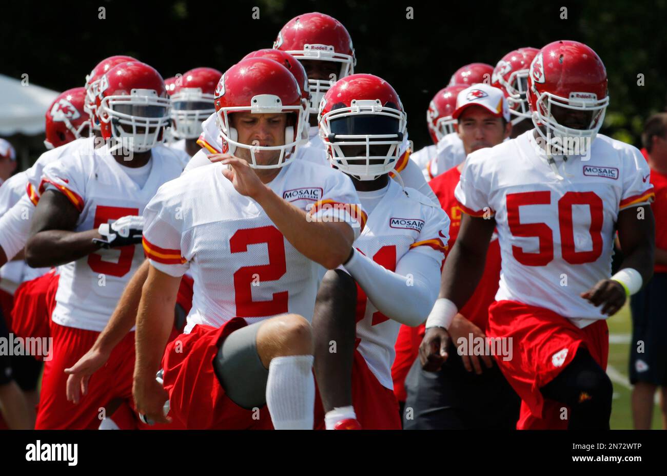 Kansas City Chiefs punter Dustin Colquitt (2) leads teammates during ...