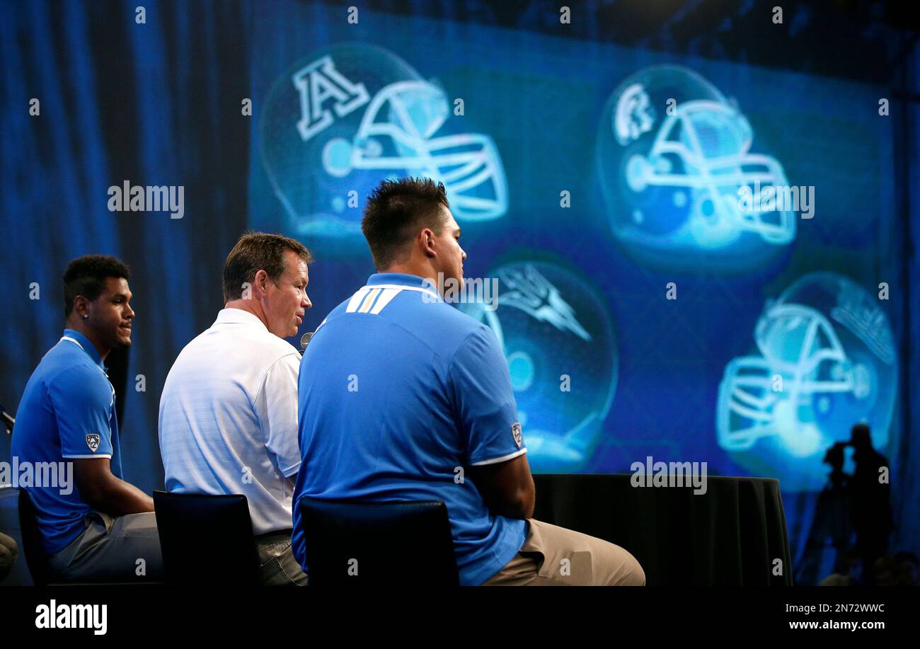 UCLA head coach Jim Mora, second from left, speaks as he is joined by ...