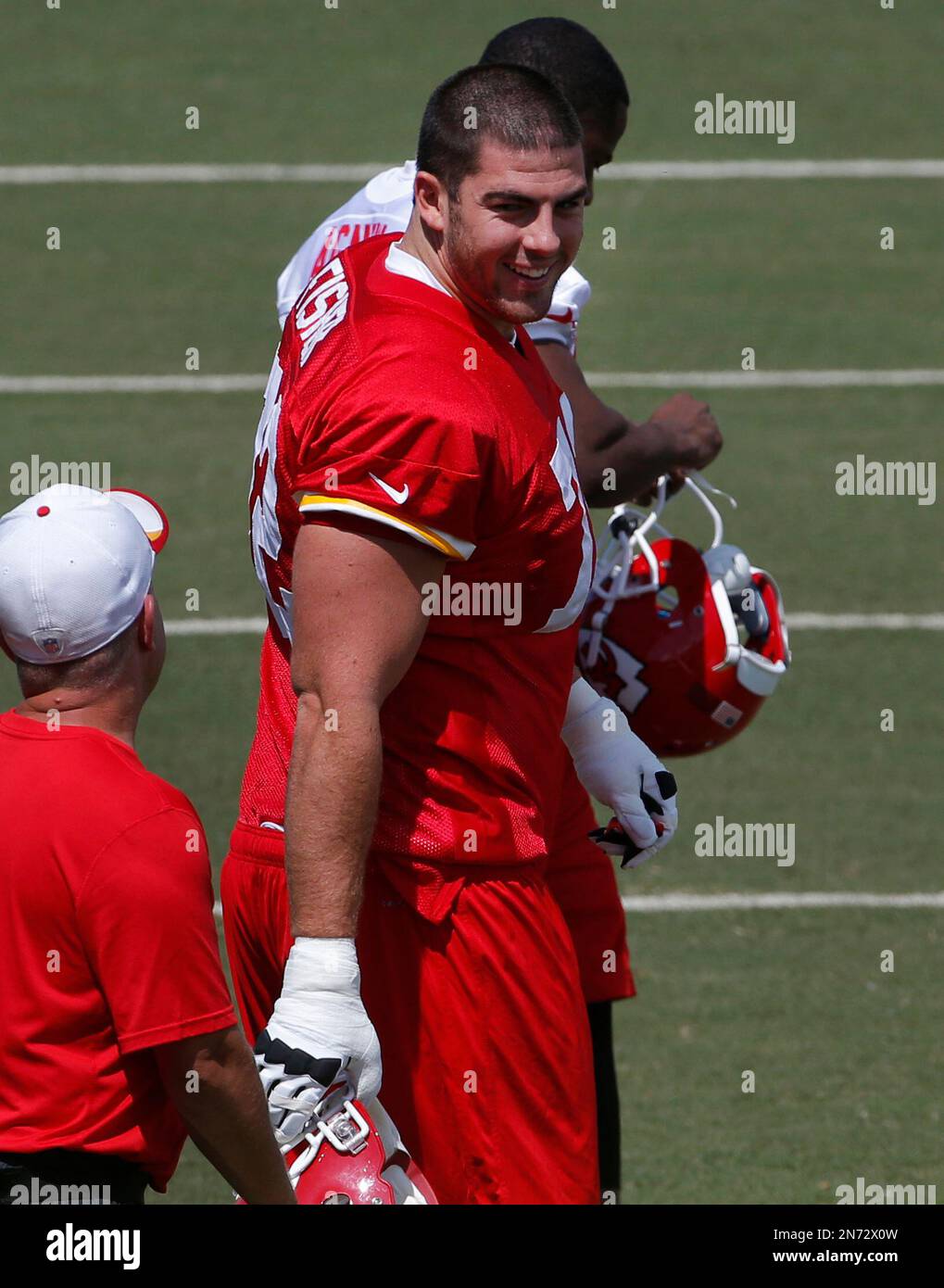 Kansas City Chiefs tackle Eric Fisher talks with teammates and staff ...