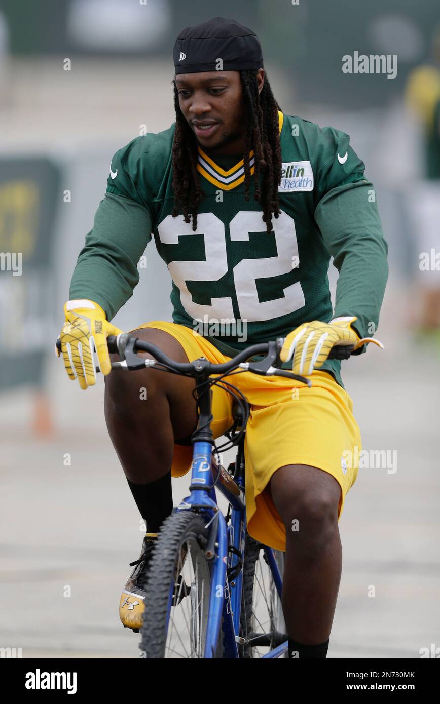 Green Bay Packers' Jerron McMillian rides a bike to NFL football ...