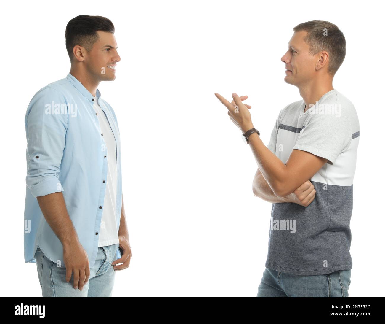 Men in casual clothes talking on white background Stock Photo - Alamy
