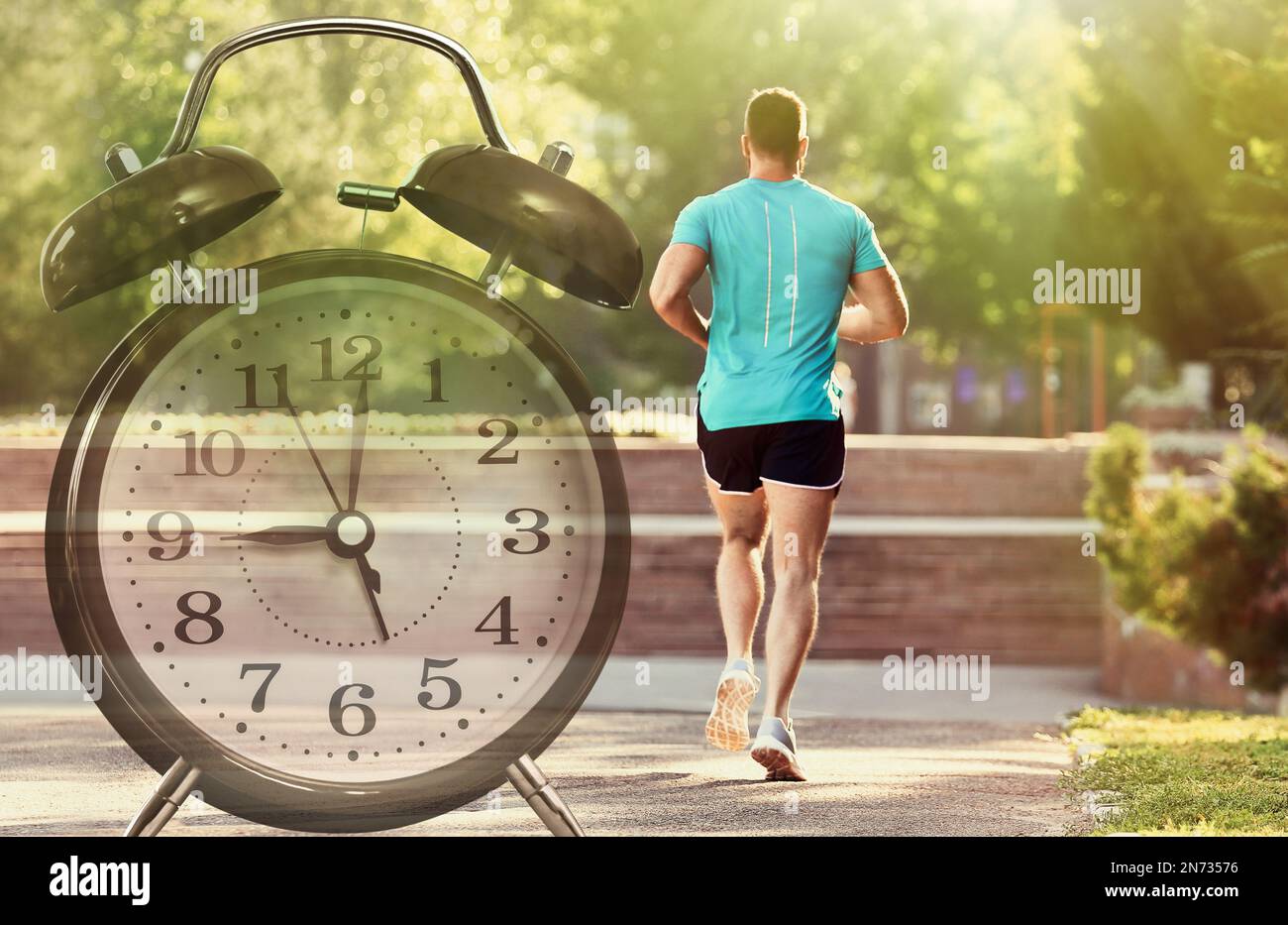 Time to do morning exercises. Double exposure of man running in park ...