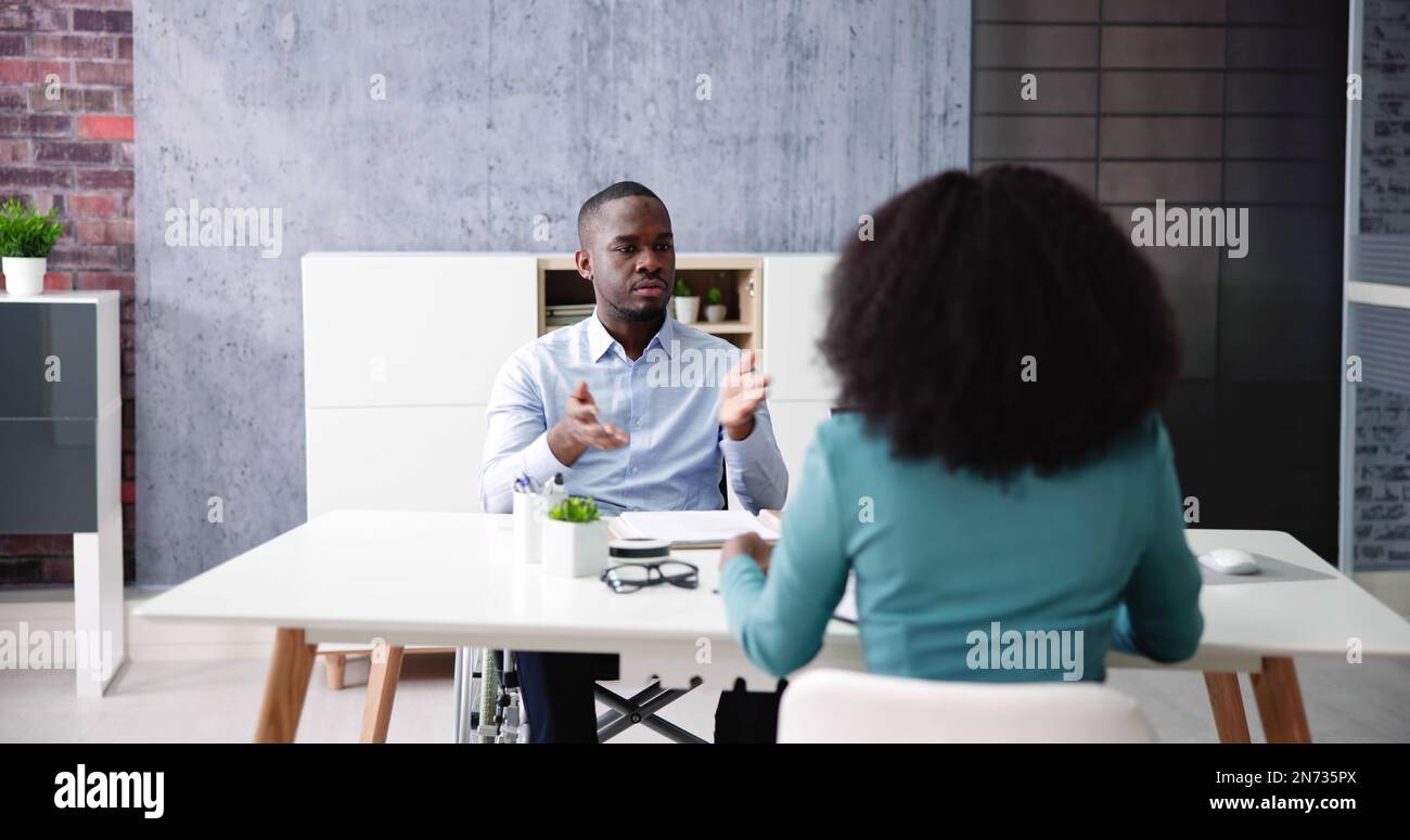 Two People Talking In Interview Recruiting Meeting Stock Photo - Alamy