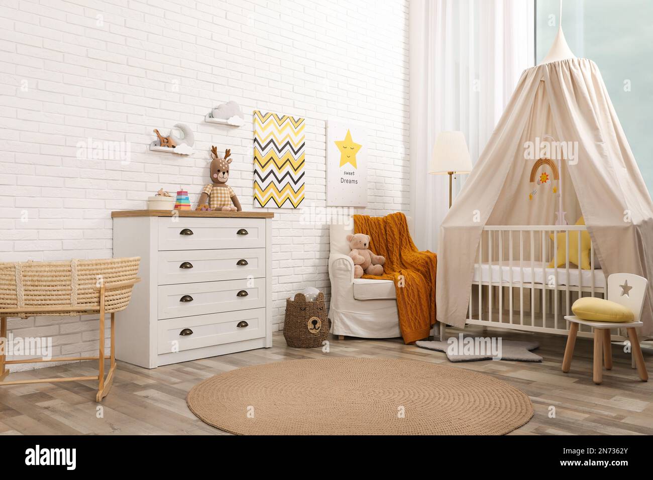 Stylish baby's room with comfortable cot. Interior design Stock Photo ...