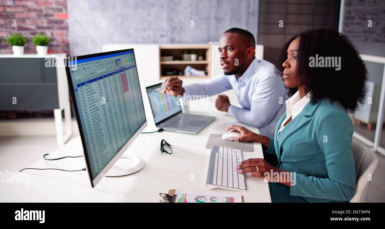 Analyst Employee Working On Spreadsheet Using Desktop Computer Stock ...