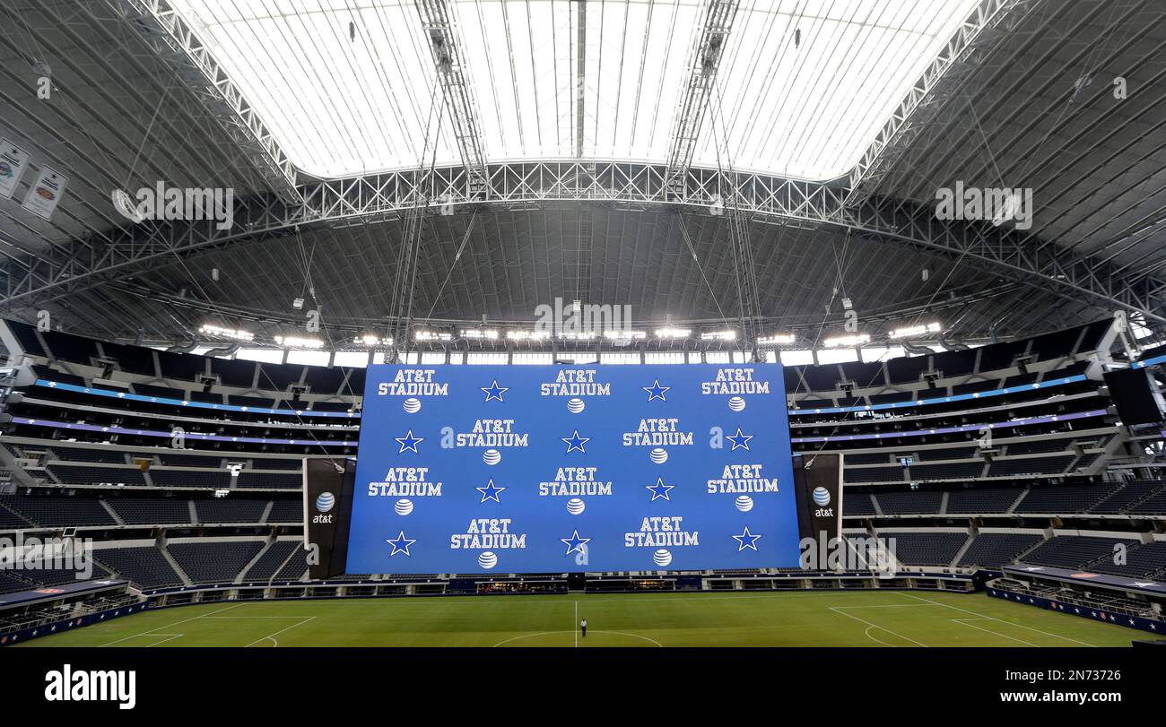 The giant screen displays the new name of the Cowboys Stadium to AT&T ...
