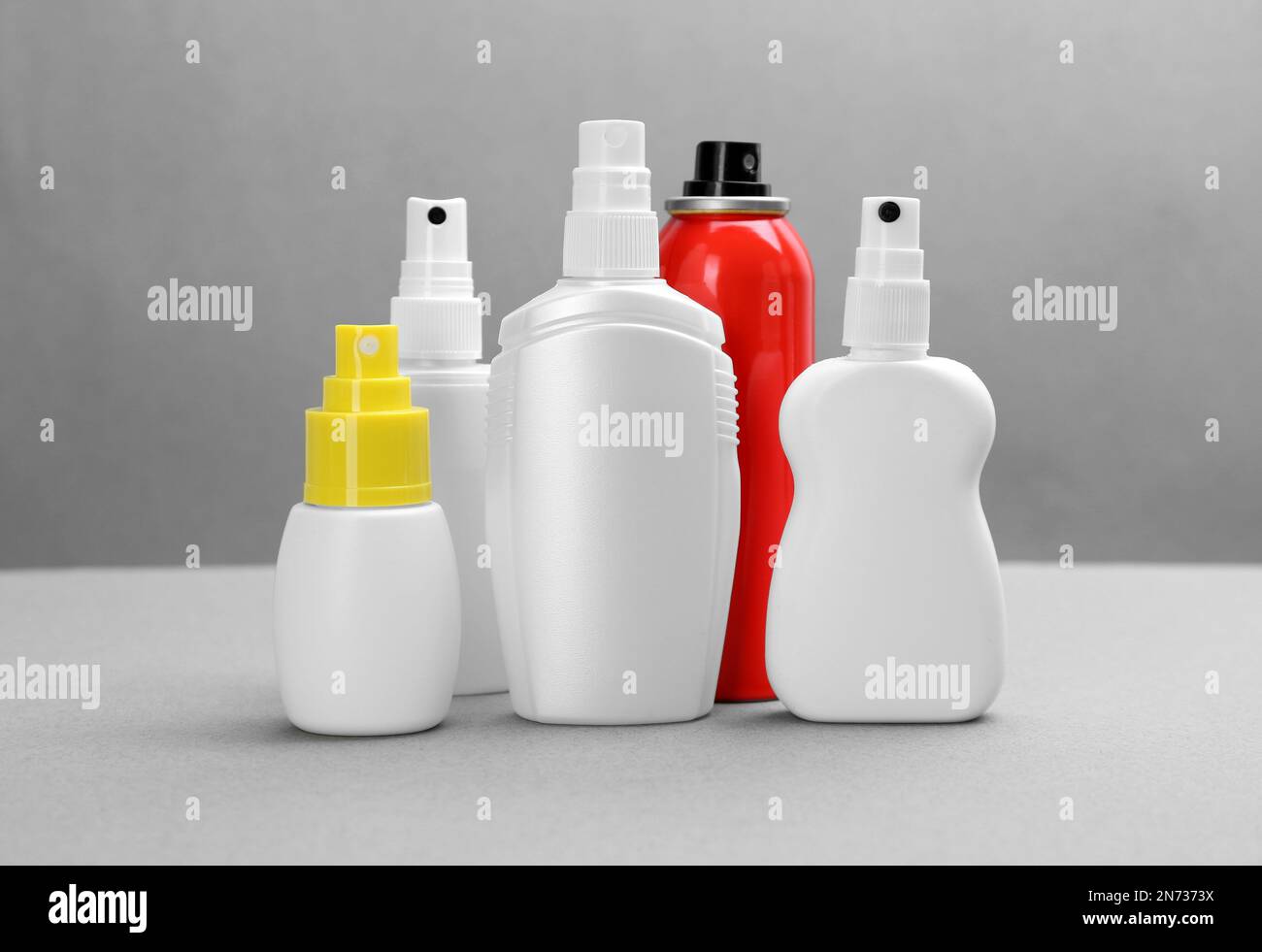 Set of different insect repellents on grey background Stock Photo - Alamy