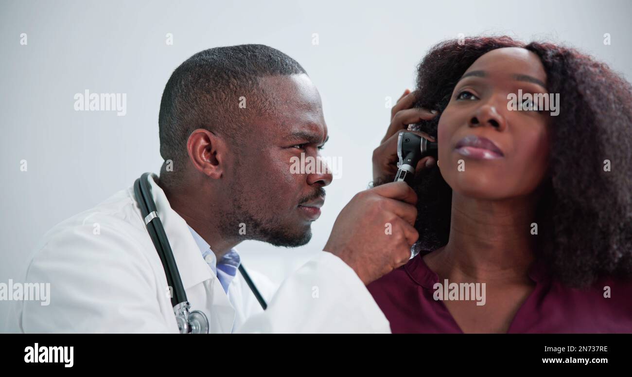Otolaryngology Ear Check Using Otoscope. Doctor Examining Patient Stock ...