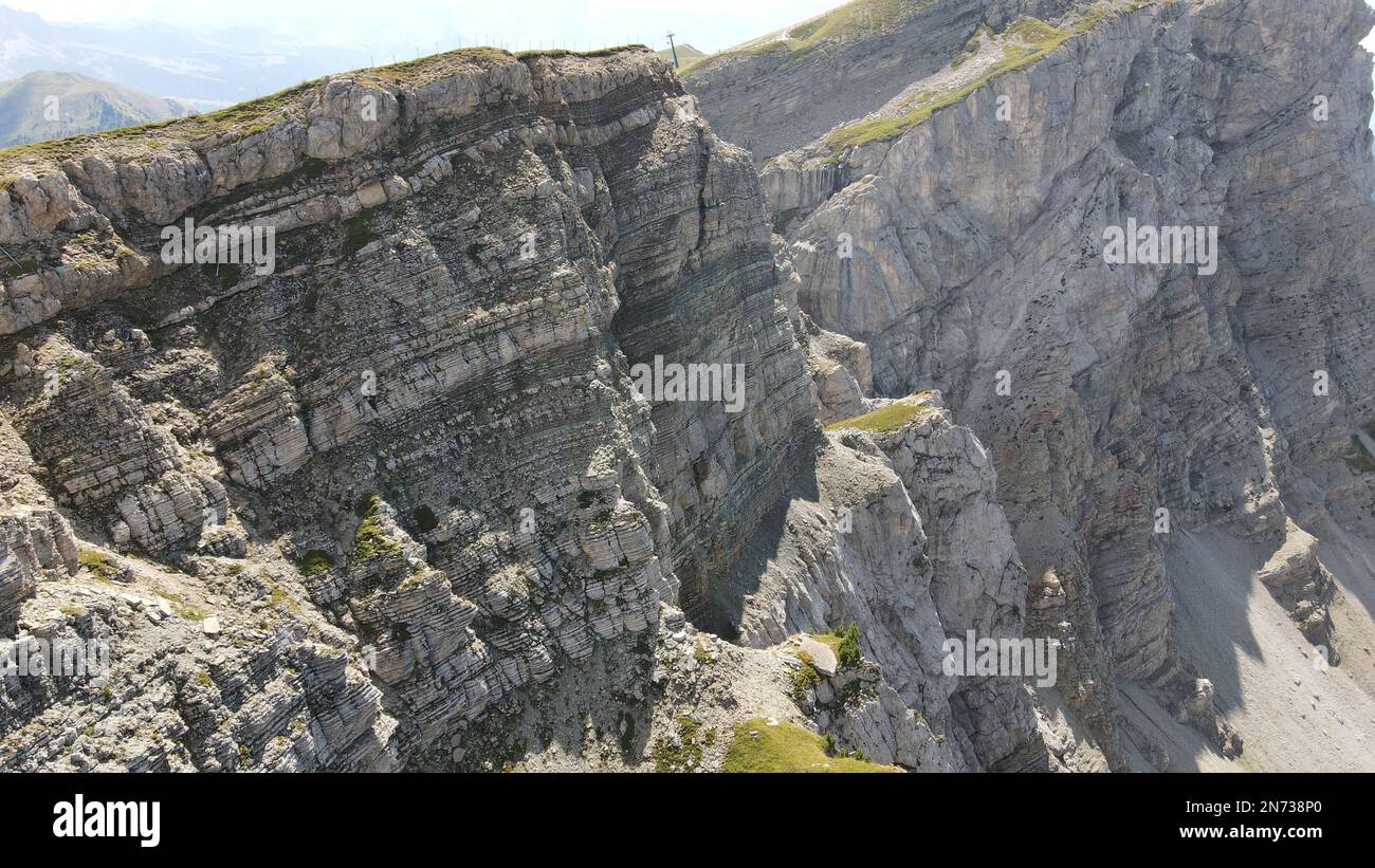 An aerial shot of Seceda Mountain under the sunlight in the Alps of ...