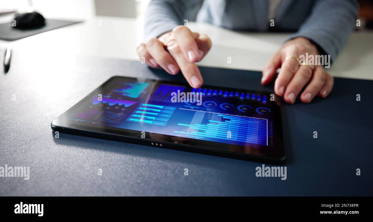 Investor KPI Analytics Graph. Hand Pointing At Data Stock Photo - Alamy