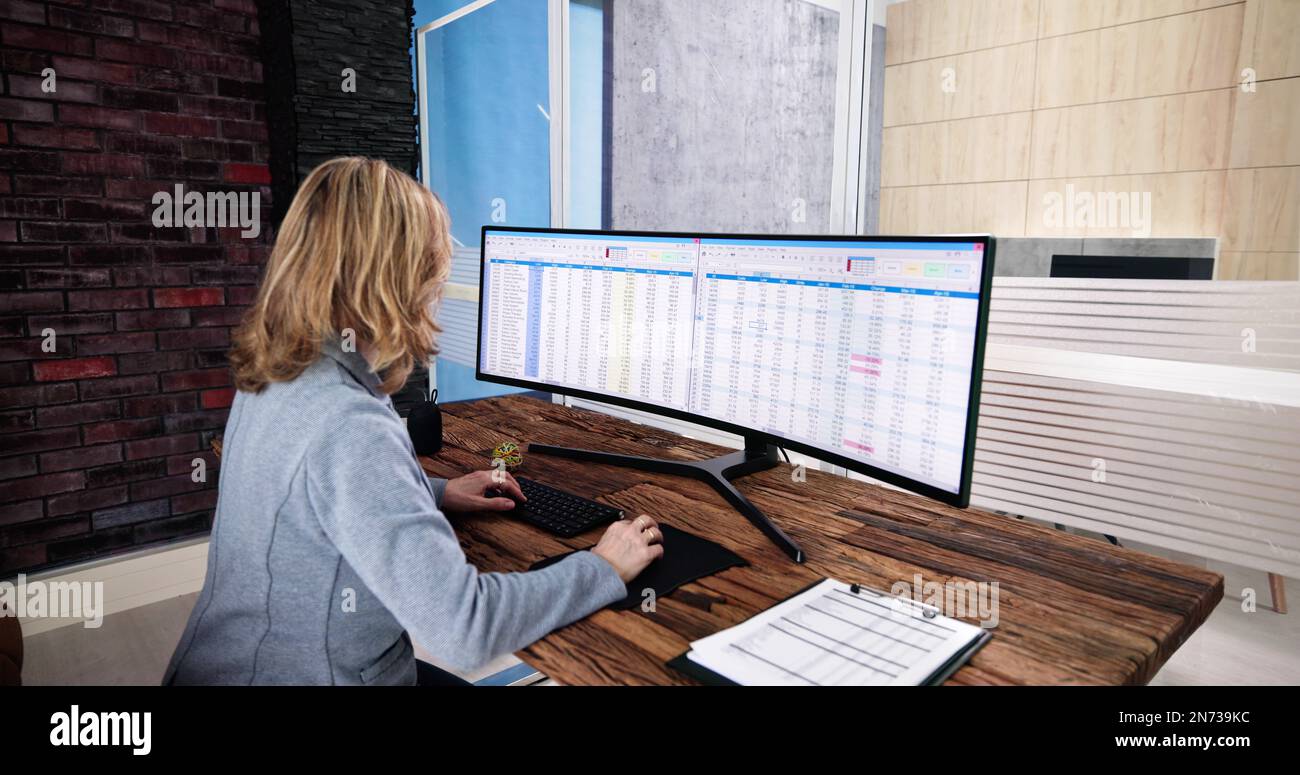 Data Analyst Woman Using Spreadsheet On Computer Stock Photo - Alamy