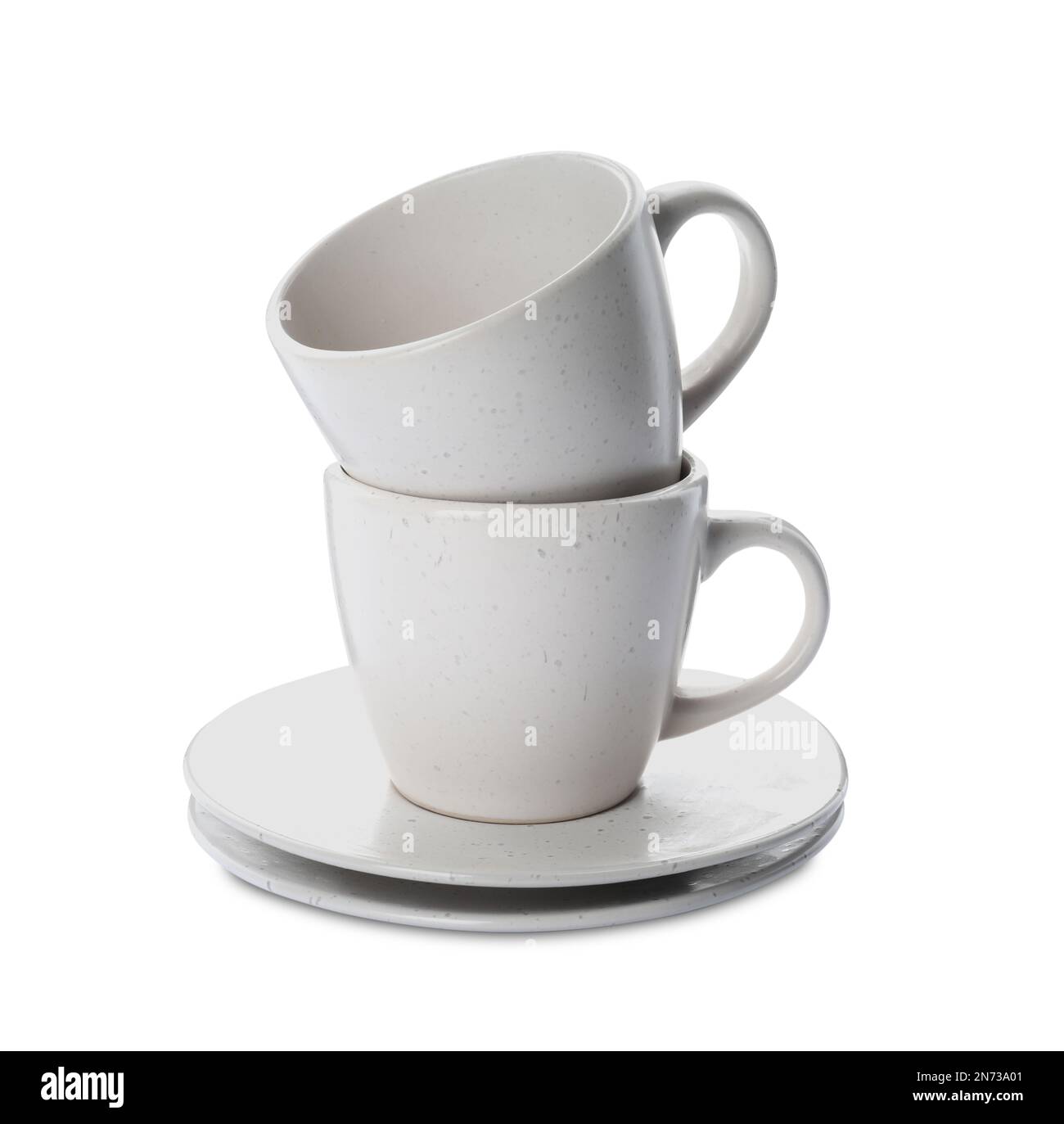 New clean ceramic cups and saucers on white background Stock Photo - Alamy