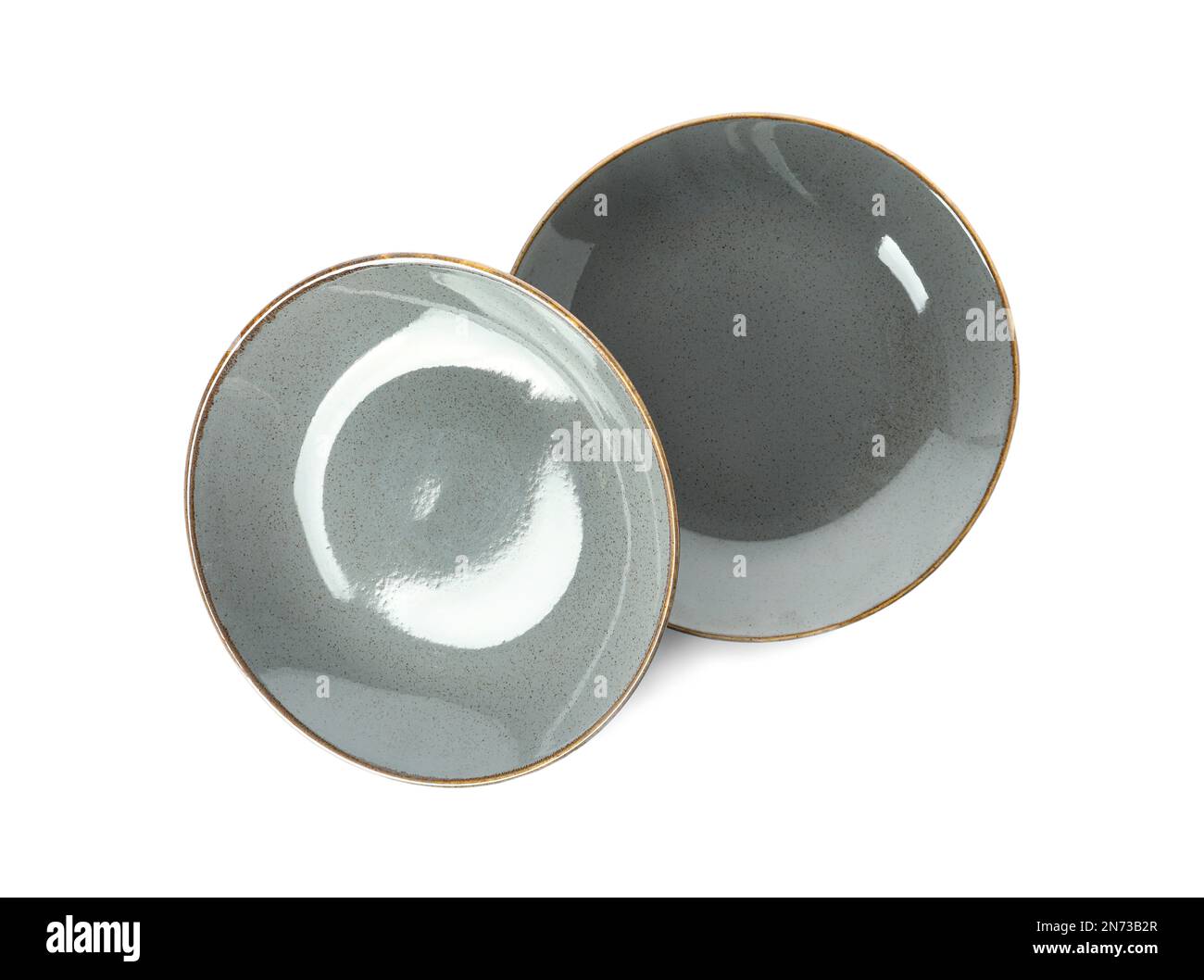 New grey ceramic plates on white background Stock Photo - Alamy