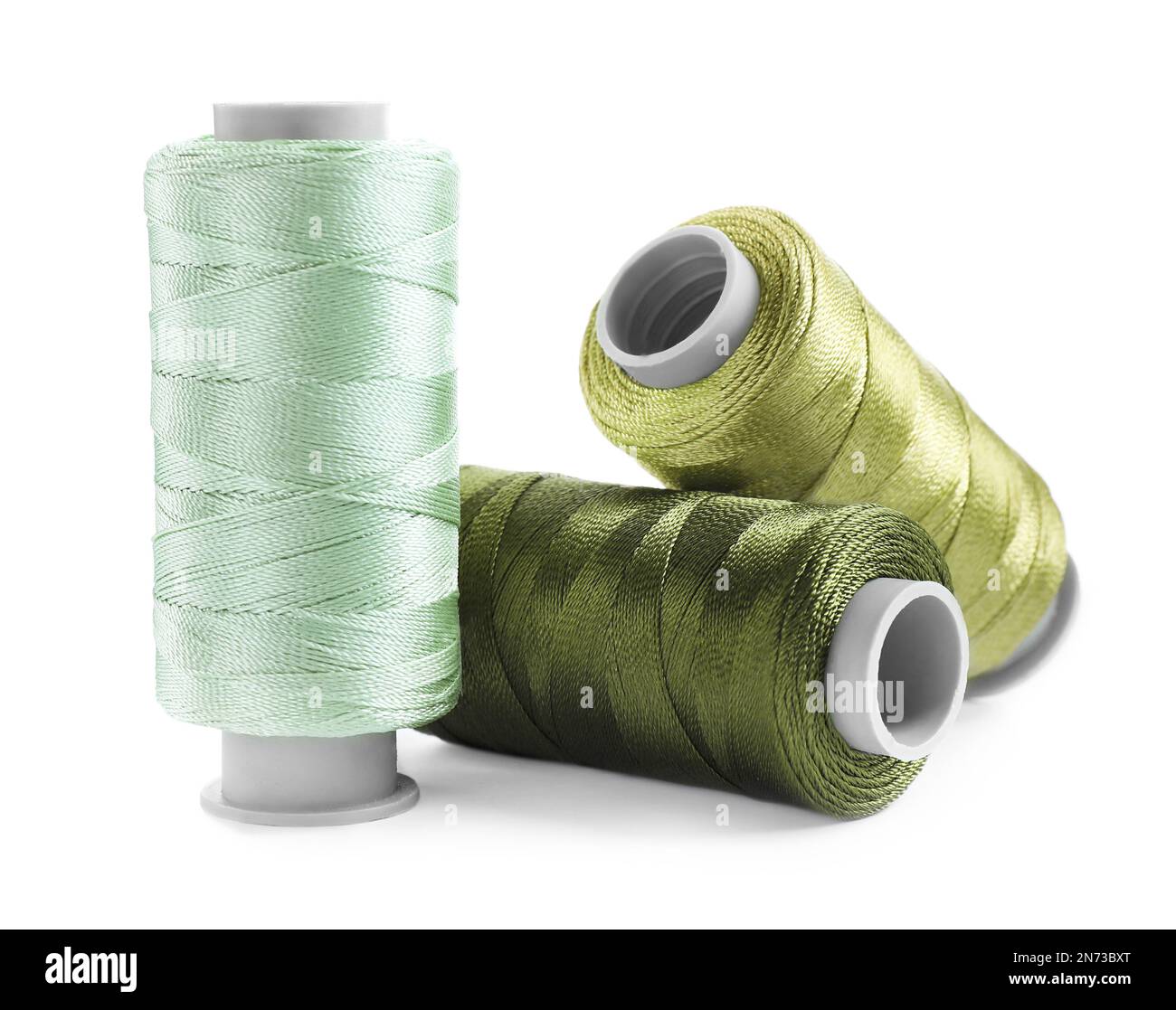 Set of colorful sewing threads on white background Stock Photo - Alamy