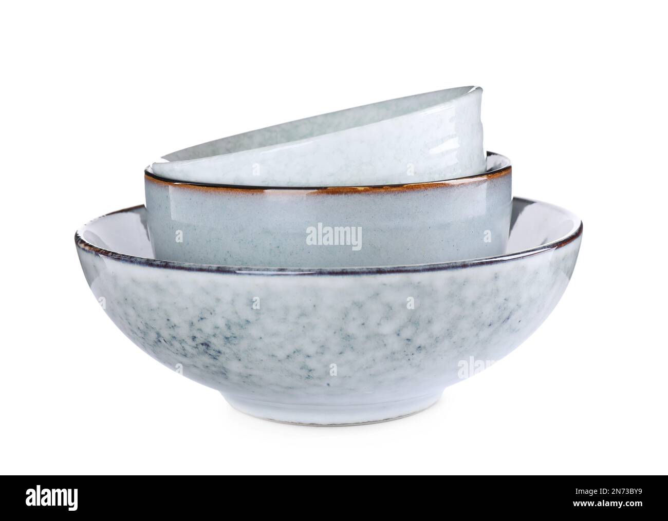 Stack of ceramic bowls on white background Stock Photo - Alamy