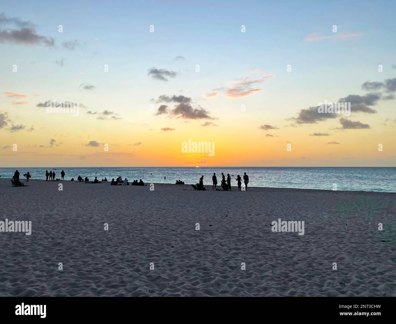 silhouette of a group of people on the beach in Aruba, at sunset Stock ...