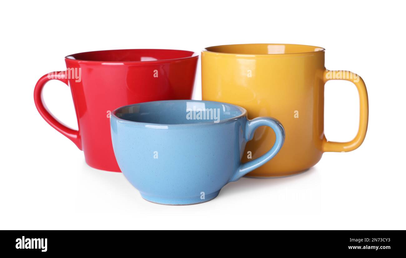 Set of colorful cups on white background Stock Photo - Alamy