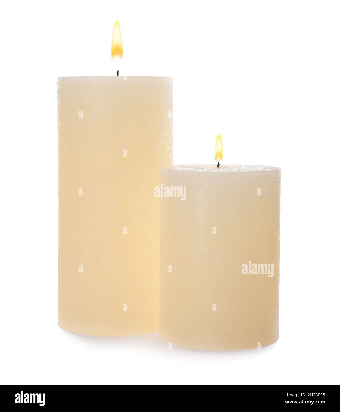 Two pillar wax candles isolated on white Stock Photo - Alamy