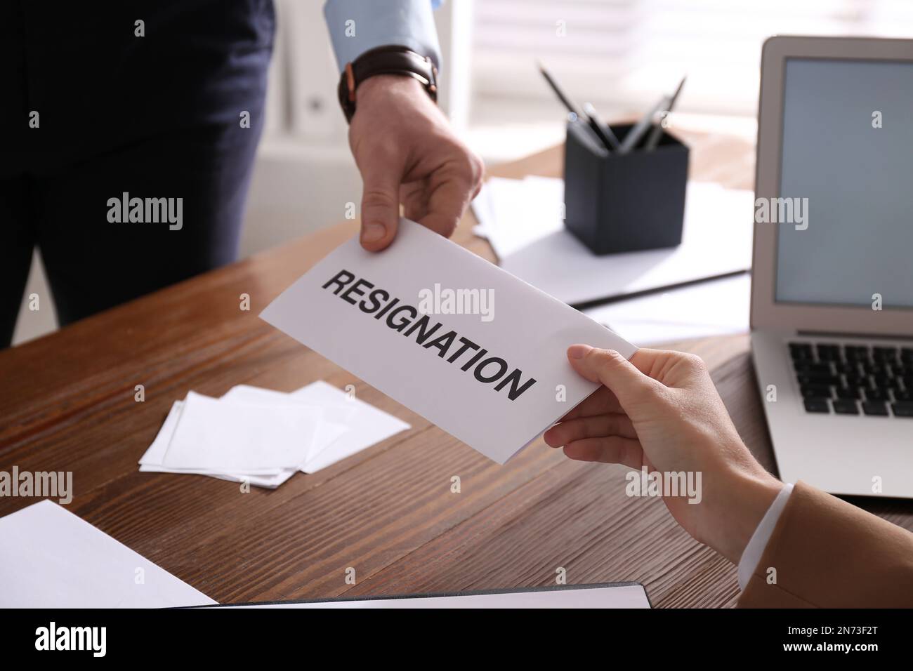 Employee giving resignation letter to boss in office, closeup Stock ...