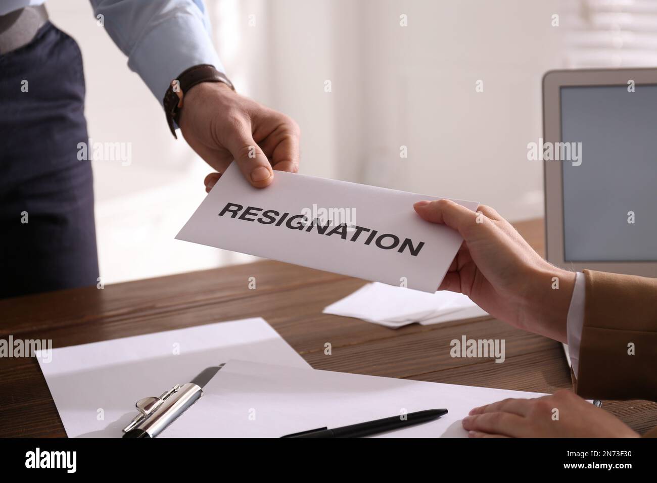 Employee giving resignation letter to boss in office, closeup Stock ...