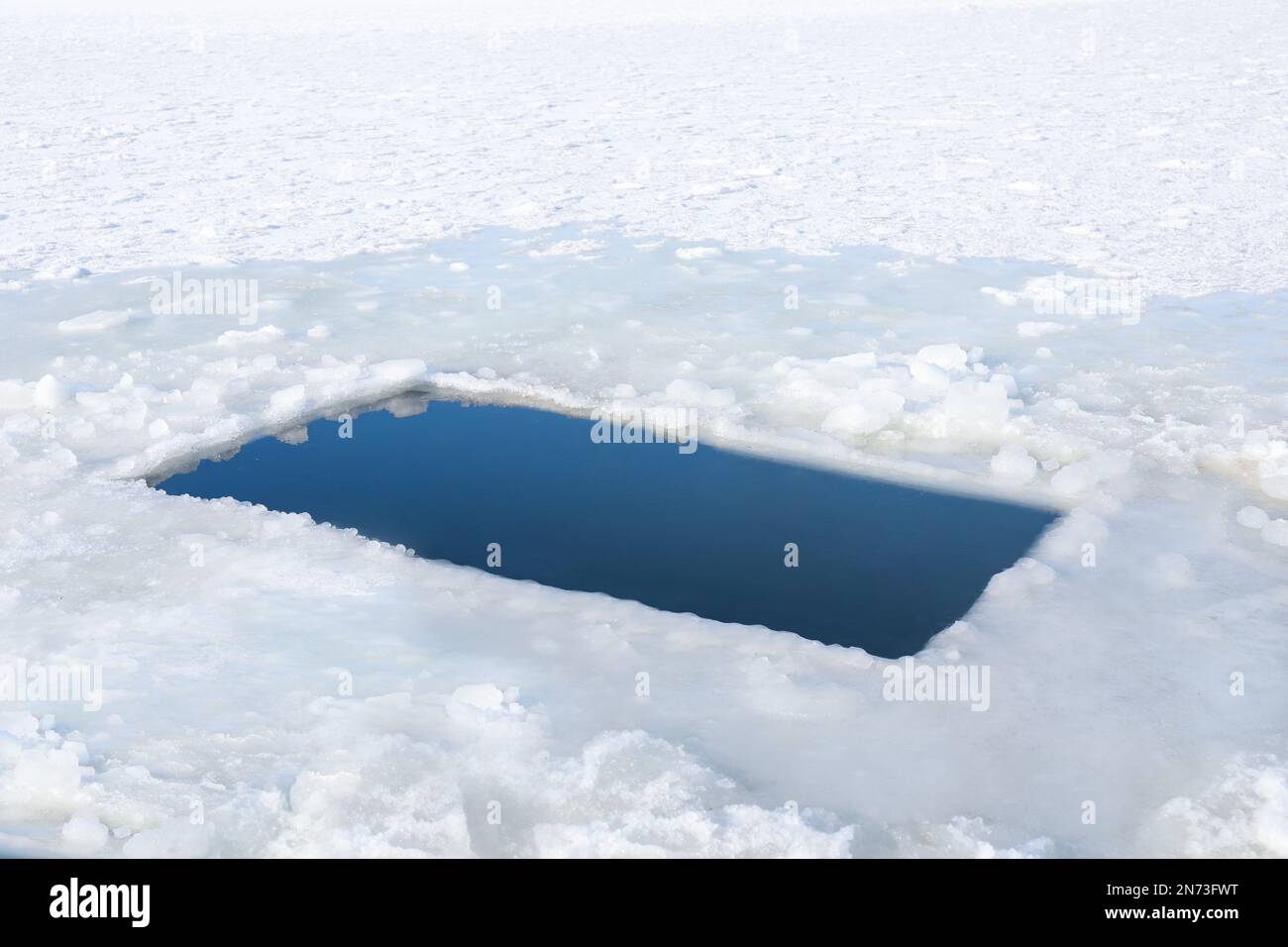 Ice hole in river on winter day. Baptism ritual Stock Photo - Alamy