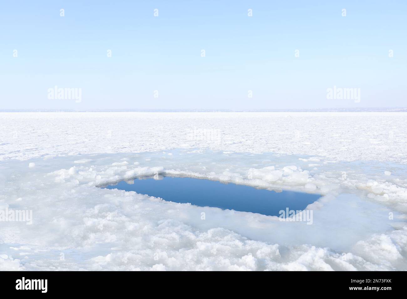 Ice hole in river on winter day. Baptism ritual Stock Photo - Alamy