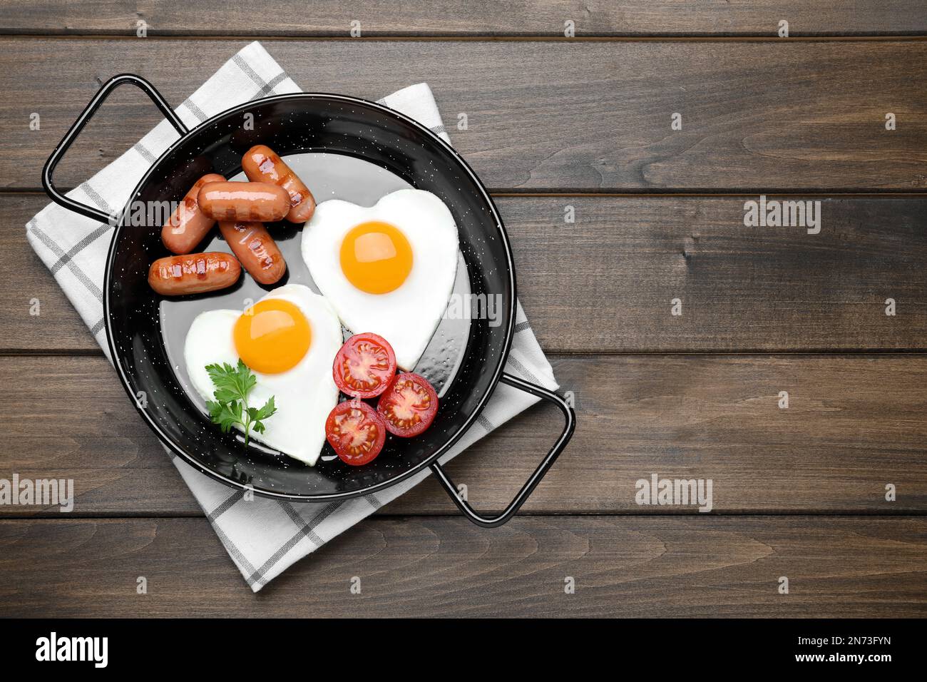 Romantic breakfast on wooden table, top view with space for text ...