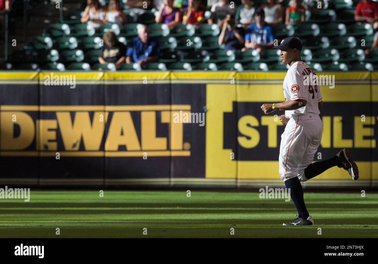Houston Astros' Justin Maxwell (44) warms up in the evening sunshine at ...