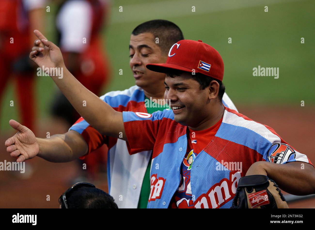 Cuba fans cheer during an exhibition baseball game against the United ...