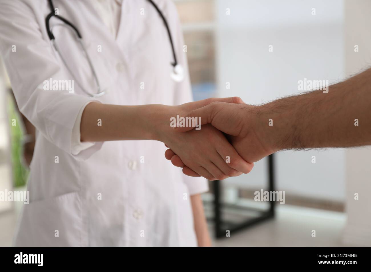 Doctor business man shake hands hi-res stock photography and images - Alamy