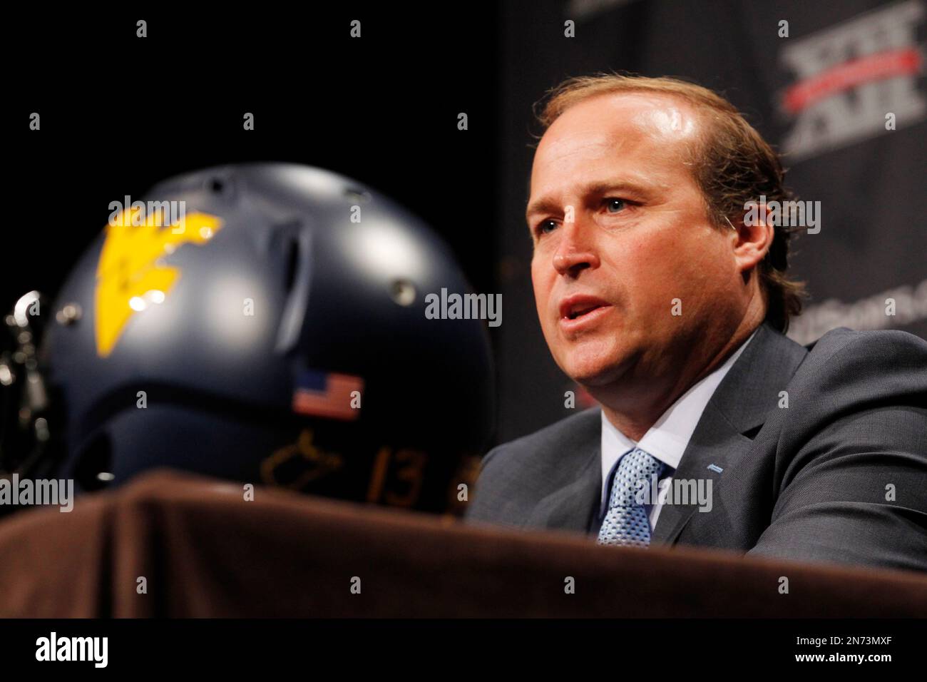West Virginia football coach Dana Holgorsen answers questions from the ...