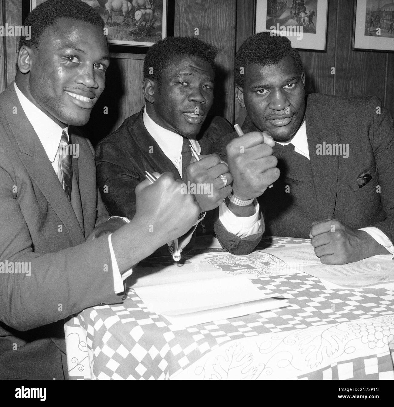 FILE - In this Jan. 3, 1968 file photo, boxer Emile Griffith is flanked ...