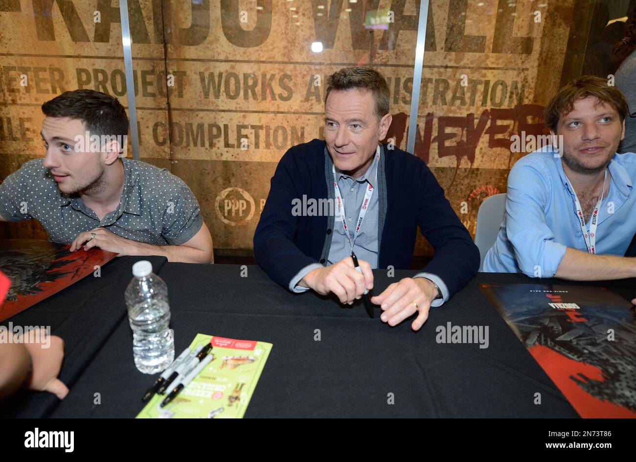 Actor Bryan Cranston of 'Godzilla' signs autographs for fans at the ...