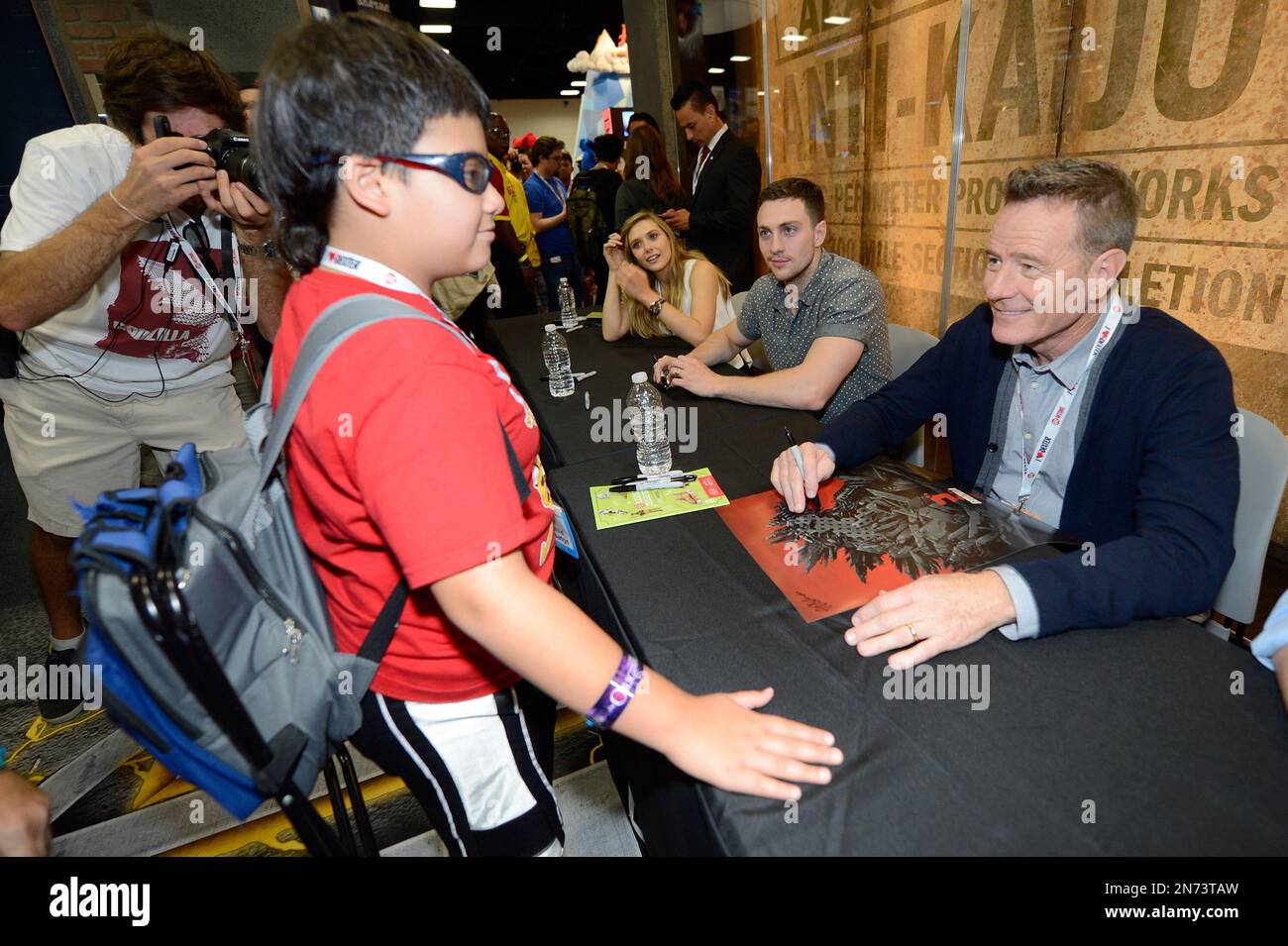 Actor Bryan Cranston of 'Godzilla' signs autographs for fans at the ...