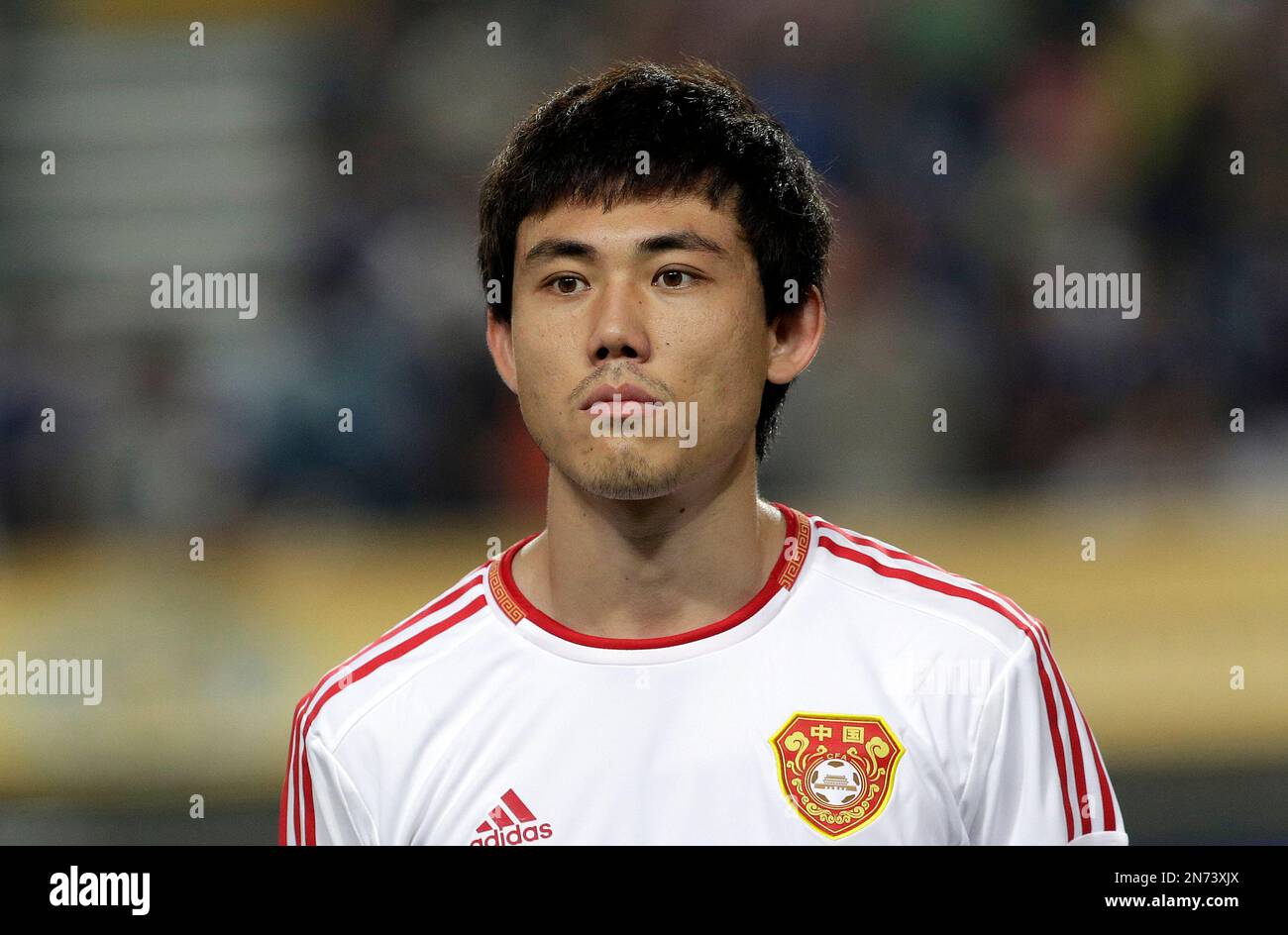 China's Li Xuepeng lines up before their East Asian Cup soccer match ...