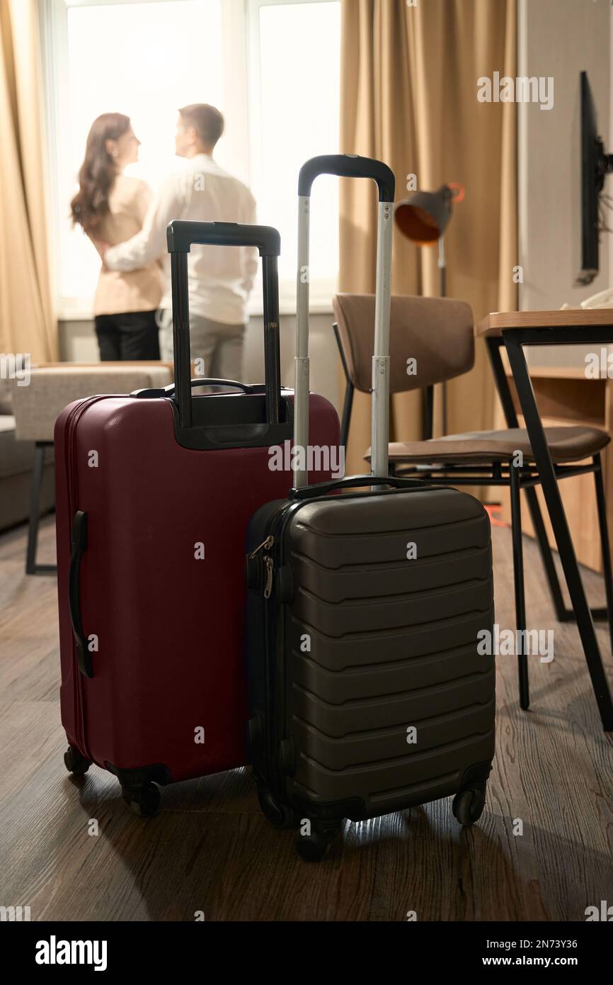 Travel suitcases stand in a hotel room Stock Photo - Alamy