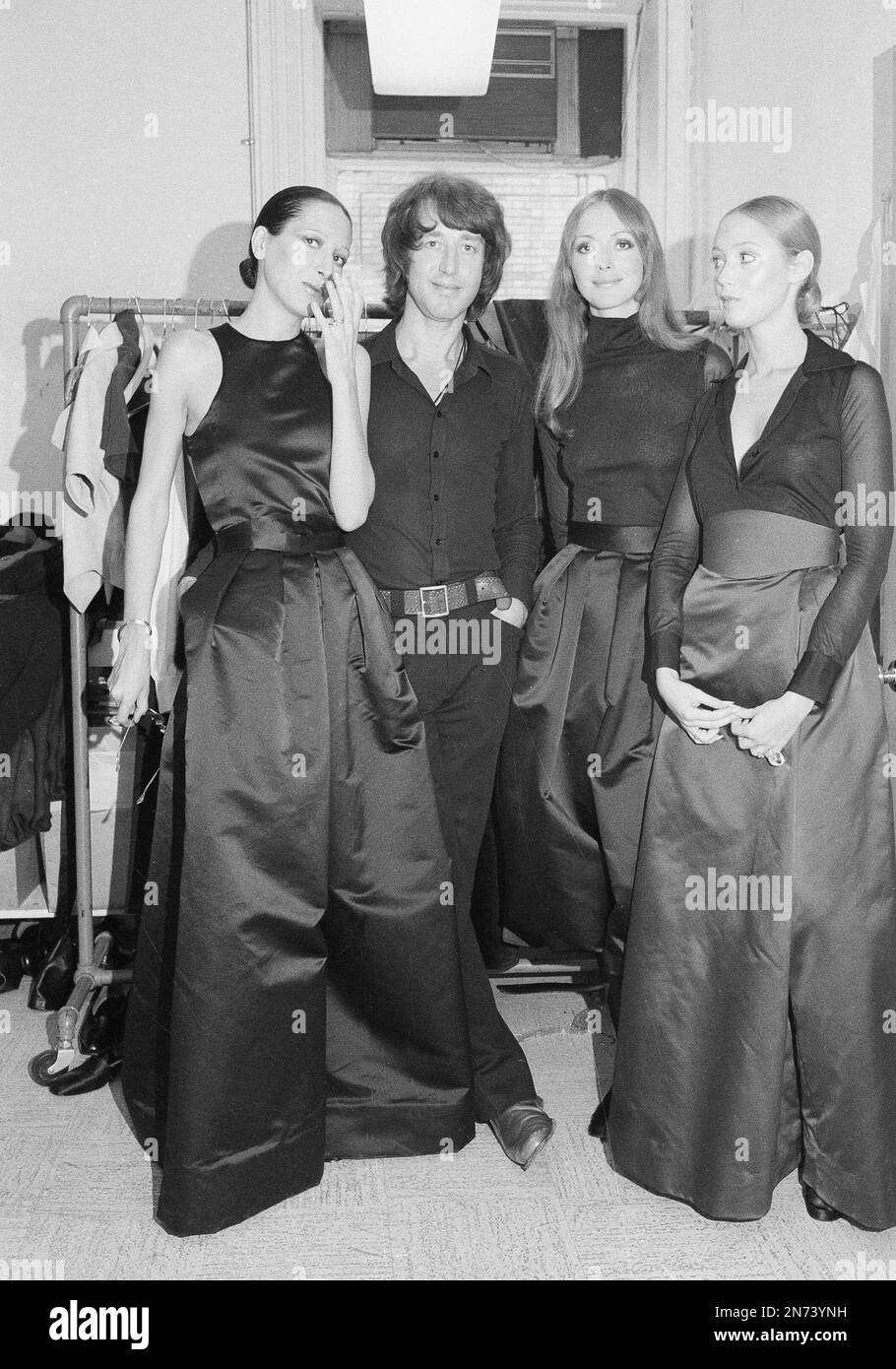 Designer Halston, second from left, poses with Elsa Peretti, left, and ...