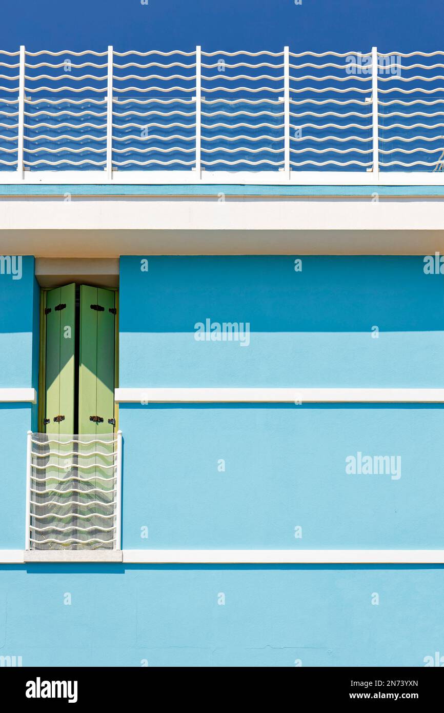 Turquoise house with green wooden door in coastal town of Caorle ...