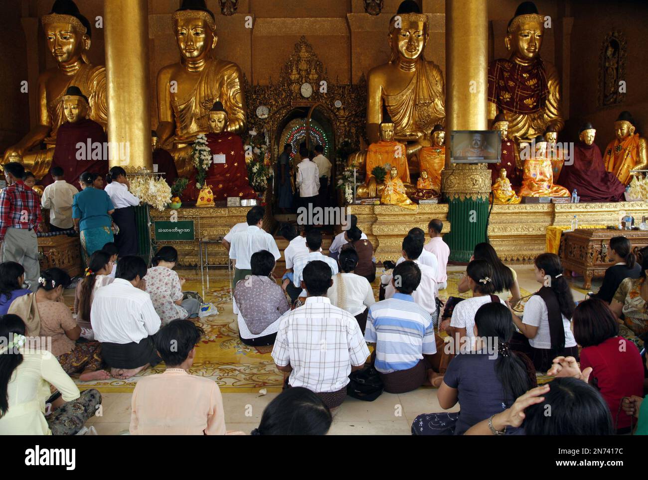Buddhist devotees pray at Shwedagon Pagoda during celebrations of the ...