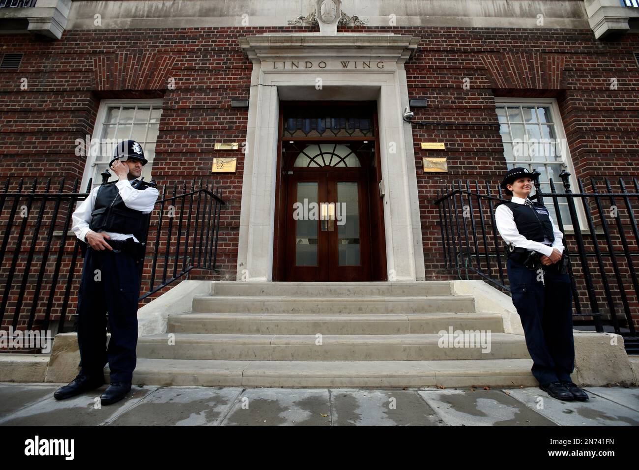 British police officers guard the entrance of St. Mary's Hospital ...