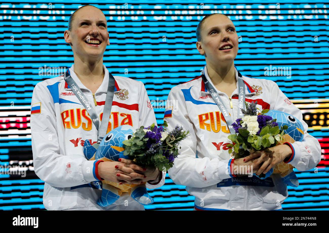 Russia's Svetlana Kolesnichenko and Svetlana Romashina, left, react on ...