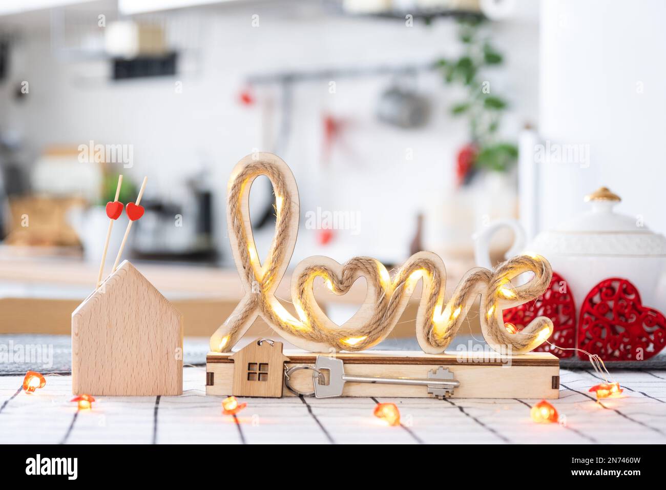Key to house of cozy home with Valentine decor on table of kitchen ...