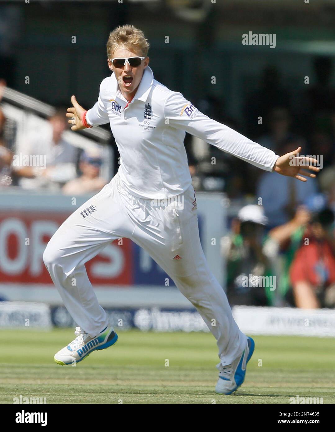 England's Joe Root celebrates taking the wicket of Australia's captain ...