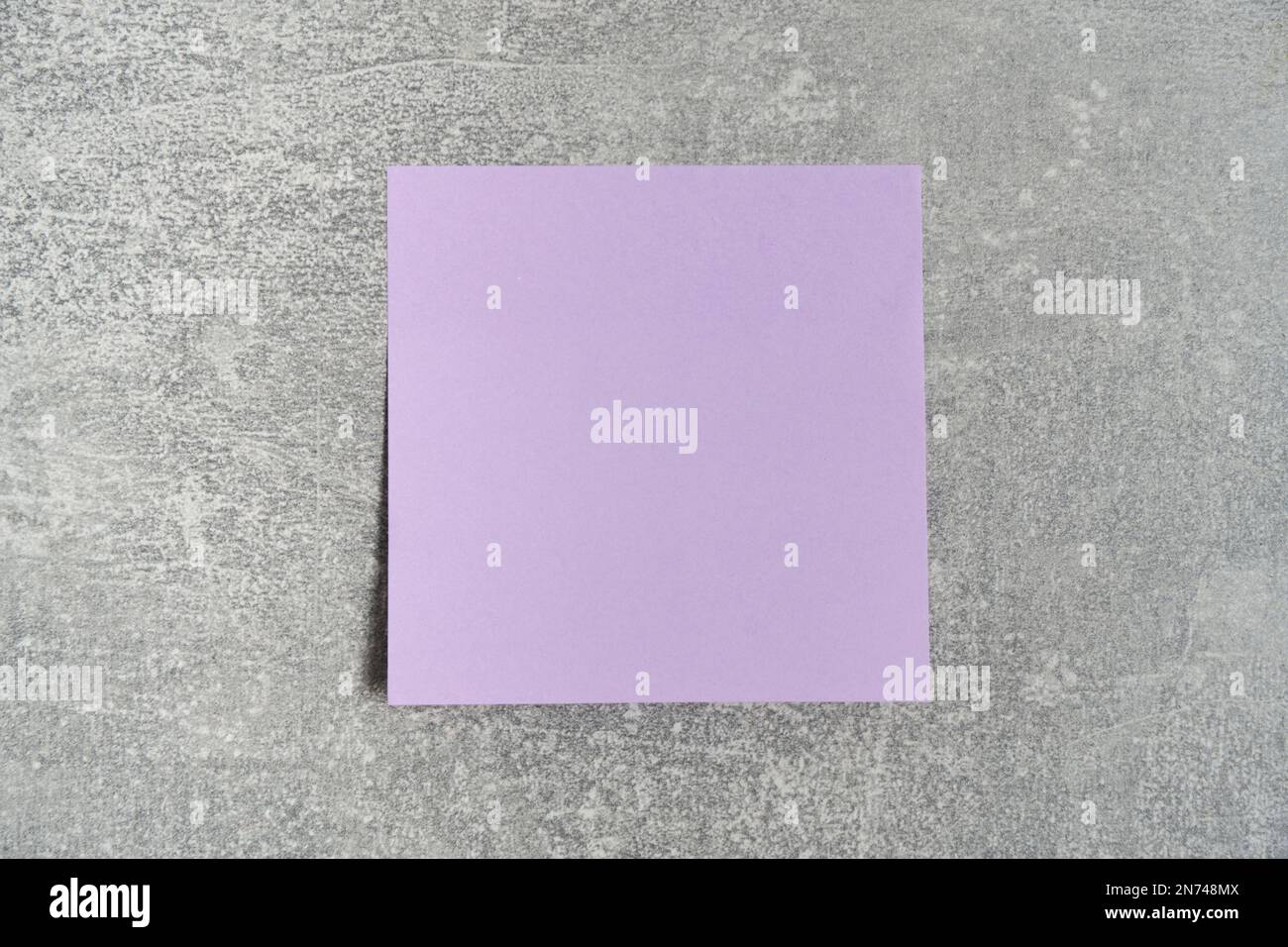 Lilac paper sticker for writing notes is pasted concrete wall Stock ...