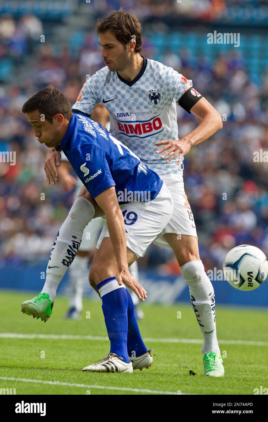 Cruz Azul´s Jeronimo Amione, front, fights for the ball with Monterrey ...