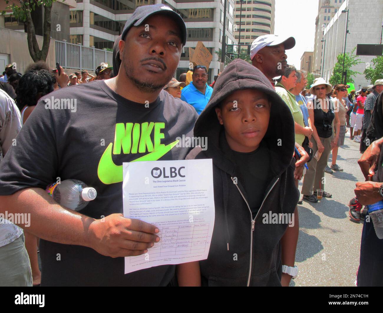 Chris Donegan, 38, stands with his son, Allen Donegan, 11, during a ...